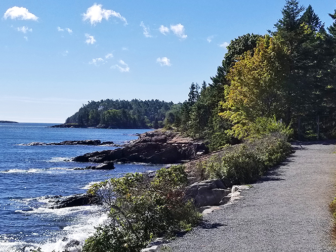 The gravel trail hugs the coastline, offering unobstructed views that make every step a new postcard-worthy moment.