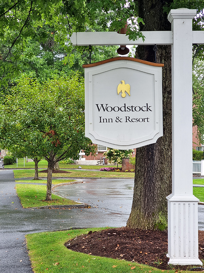 The Woodstock Inn sign stands sentinel, promising adventures that your Instagram followers will secretly envy for months to come.