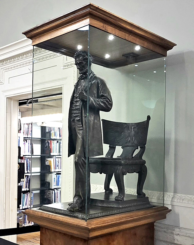 A dignified Lincoln stands eternally vigilant in his glass case, silently reminding visitors of the power of words and democratic ideals.