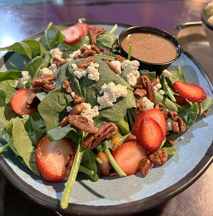 Who said healthy can't be heavenly? Fresh spinach, sweet strawberries, and crunchy pecans make this salad worth putting down your phone.