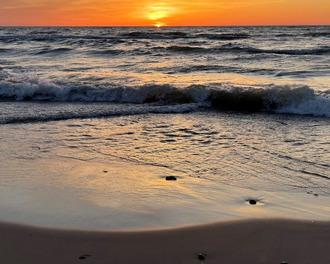 That magical moment when Lake Michigan transforms into liquid gold, making you forget every workday worry in an instant.