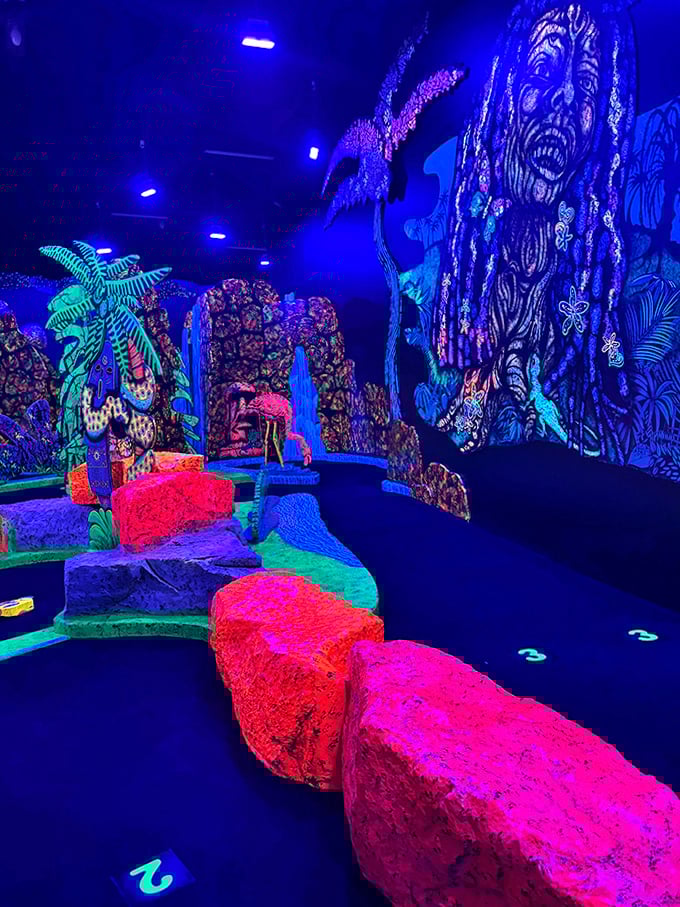 Neon dreamscape meets mini-golf madness—where glowing rocks and psychedelic jungle murals turn putting into pure electric fun!