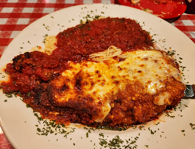 The veal parmigiana arrives like an Italian grandmother's hug on a plate – tender, saucy, and melty enough to make you temporarily forget about pizza.
