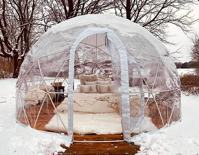 Winter transforms the landscape into a pristine wonderland, with the transparent dome offering front-row seats to the snow show.