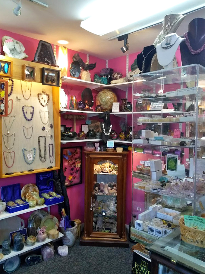 The crystal and gemstone corner glows with natural treasures, where pink walls create the perfect backdrop for nature's most dazzling creations.