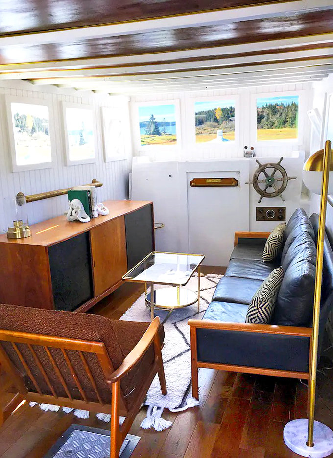 Step inside the captain's quarters where maritime memorabilia and mid-century modern furnishings create an unexpected harmony.