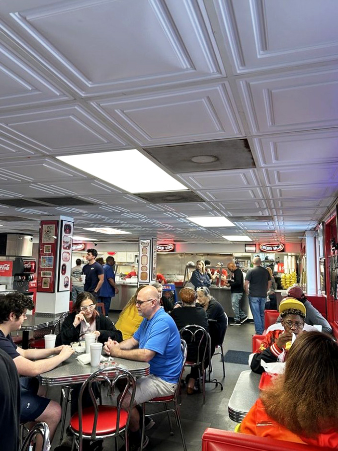 The bustling dining area hums with conversation as patrons enjoy their meals in this shrine to simple, delicious food.