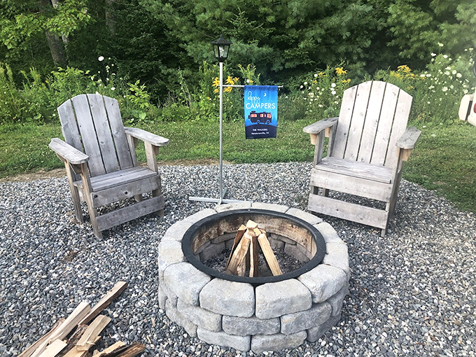 The stone fire pit area creates a natural gathering spot where stories flow as freely as the evening conversations.