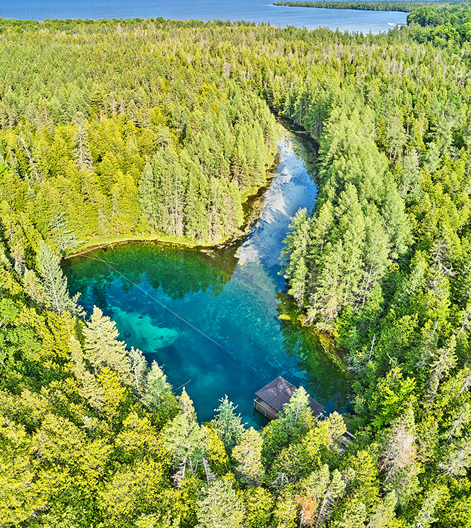 From above, Kitch-iti-kipi resembles a perfect teardrop of turquoise nestled among Michigan's dense forests &ndash; nature's own gemstone.
