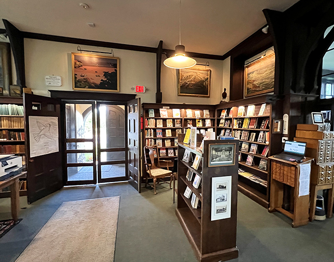 The library's entrance area welcomes visitors with organized displays and warm wooden tones that whisper, "Stay awhile and read something wonderful."