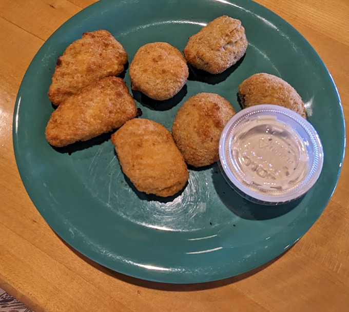 Golden-brown poppers with crispy exteriors hiding molten, creamy centers – these little treasures might make even Gollum forget his precious ring.