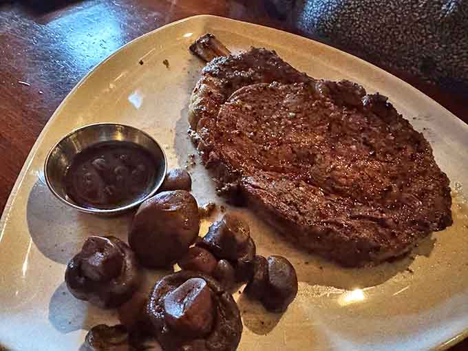 A steak that would make even the most dedicated vegetarian pause – perfectly seared, accompanied by mushrooms that have been marinated in magic.