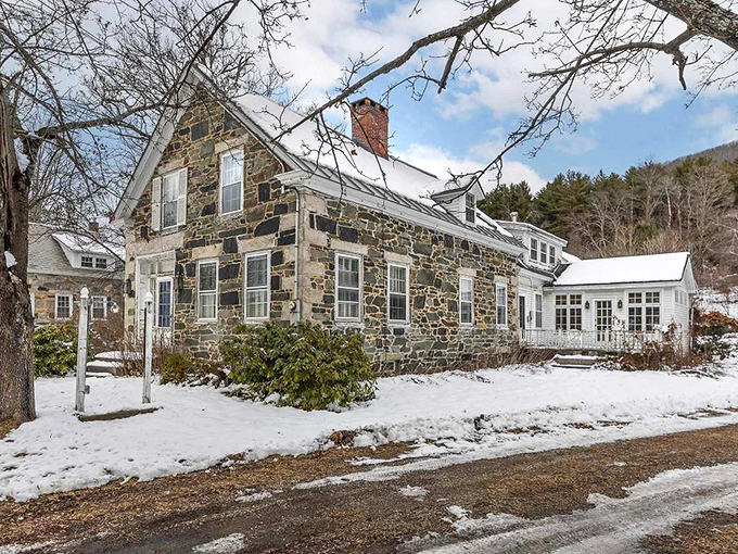 Winter transforms this classic farmhouse into a scene so quintessentially Vermont you can almost smell the maple syrup cooking.