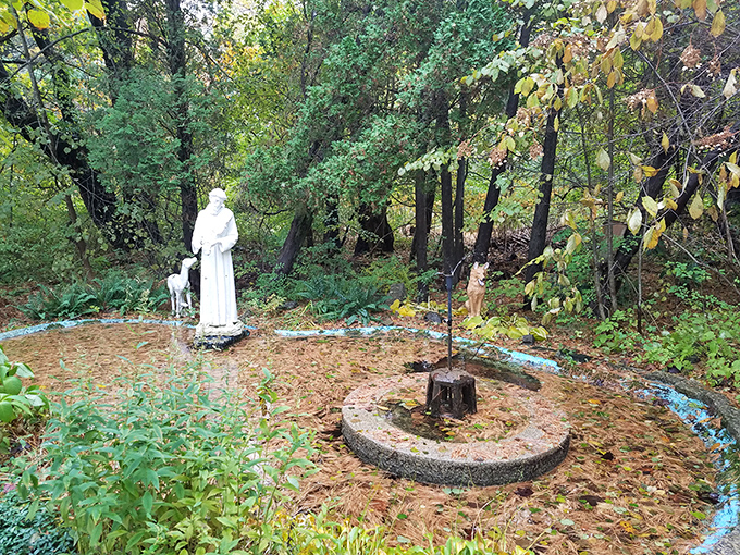 St. Francis of Assisi watches over the monastery grounds, his statue a reminder of the Franciscan traditions that shaped this peaceful sanctuary.