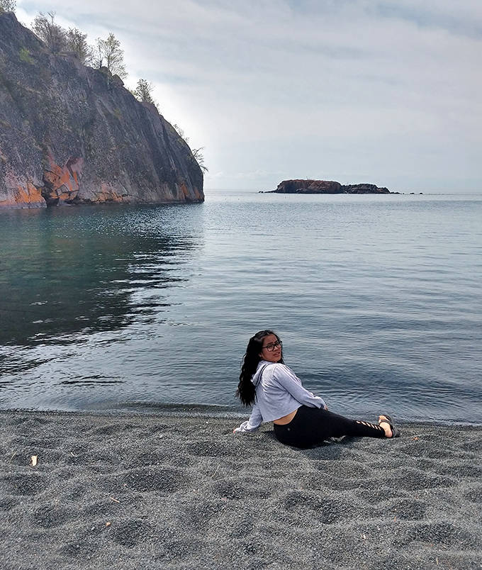 Explorers find their bliss where unusual black sands meet Lake Superior's refreshing embrace.