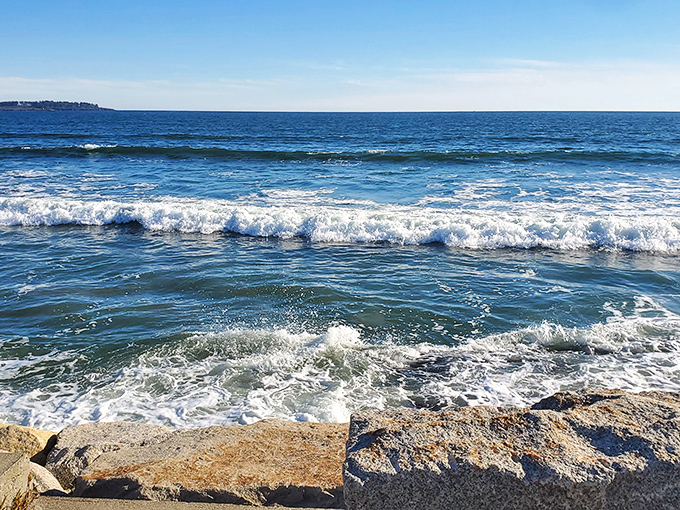 Surfers dance with emerald waves, finding that perfect balance between gravity and grace in Maine's surprisingly excellent surf breaks.