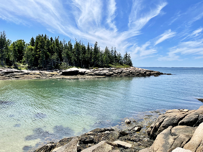 Deer Isle's clear, shallow waters create a painter's palette of blues and greens, inviting exploration of its pristine shoreline.