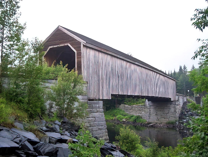 Lowe's Bridge connects not just two towns but two centuries, its wooden frame a living link to Maine's transportation history.