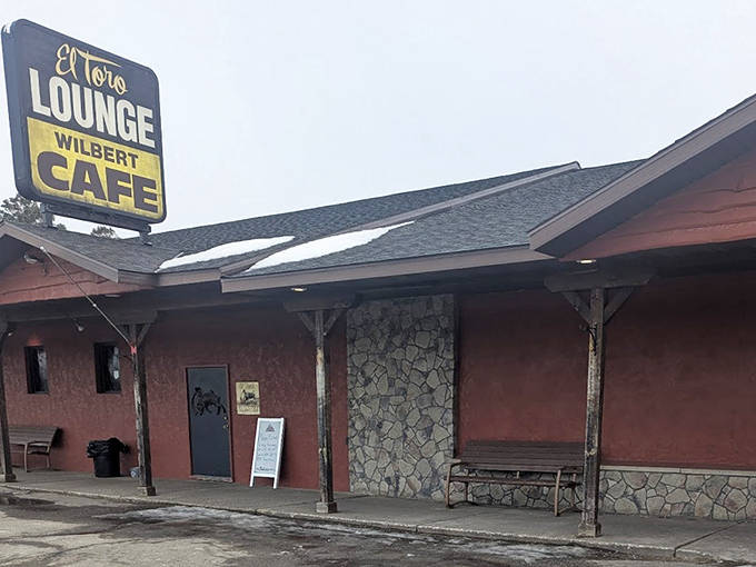 The El Toro Lounge sign might catch your eye first, but locals know the Wilbert Cafe is where Cotton's best meals are served. Rustic stone and wood exterior hints at the cozy atmosphere inside.