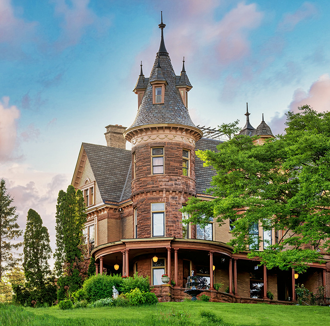 The castle's warm stone exterior and Victorian details hint at the luxurious bed and breakfast experience waiting inside.
