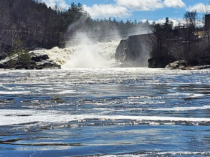 The massive volume of water at Rumford Falls creates a misty spectacle that changes with each season.