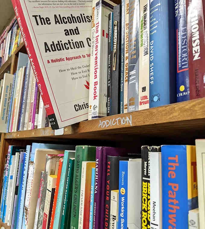 Self-help books line these shelves, offering guidance and wisdom for life's challenges &ndash; proof that the right book finds you when needed.