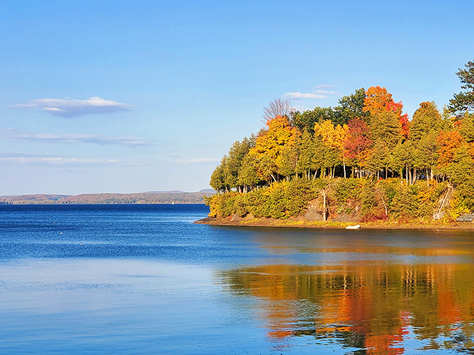 Fall foliage reflected in Lake Champlain – Mother Nature showing off with a double dose of autumn glory.