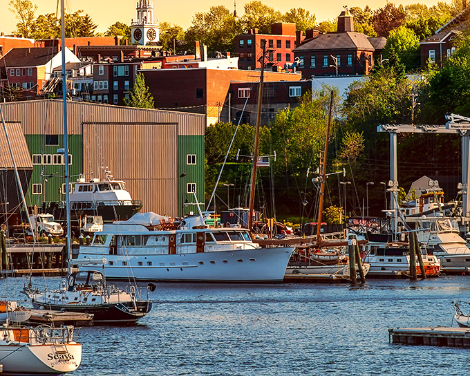 The harbor buzzes with boats of all sizes, from working lobster vessels to pleasure craft enjoying Maine's coastal playground.
