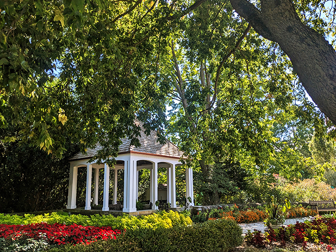 The elegant gazebo at Boerner Botanical Gardens offers a moment of refined tranquility amid meticulously maintained flower beds and shrubs.