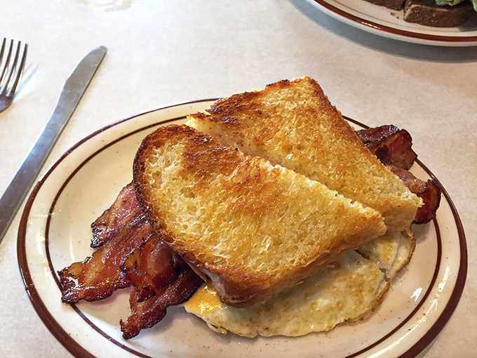 The Breakfast BLT proves that bacon, eggs, and toast were always meant to be together, like a delicious morning reunion of old friends.