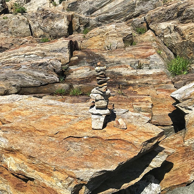Stacked stones mark the trail like nature's breadcrumbs &ndash; each one placed by previous hikers leaving their temporary mark.