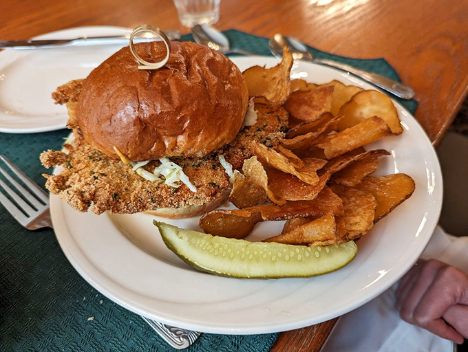 The chicken schnitzel sandwich brings Bavarian flair to handheld form &ndash; crispy breaded cutlet nestled in a soft bun with house-made chips standing guard.