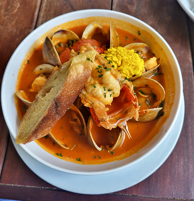 The Cioppino arrives like a treasure chest of seafood &ndash; clams, shrimp, and fish swimming in a tomato broth that begs to be sopped up.