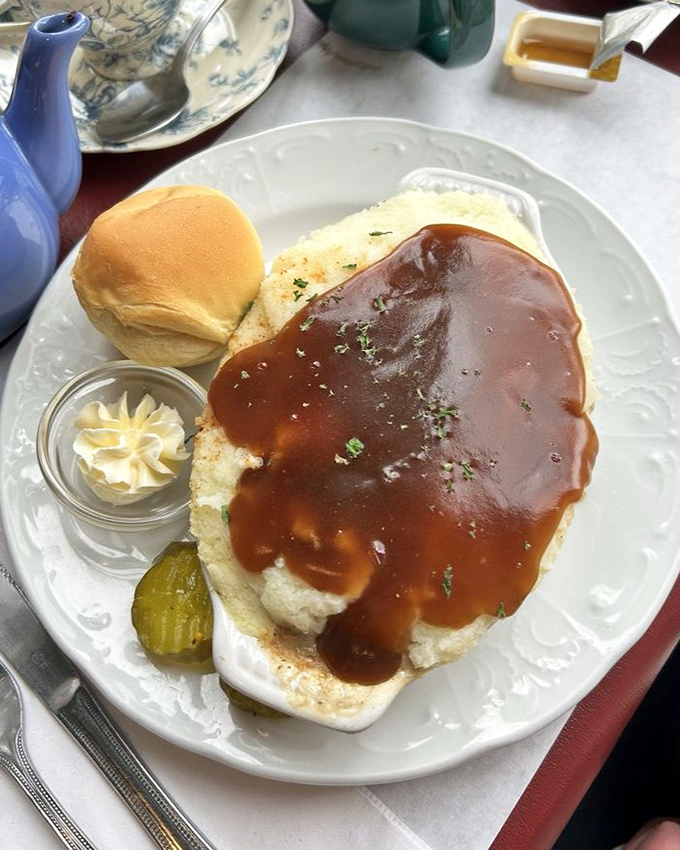 Cottage pie done right &ndash; savory ground beef hiding under a golden-brown potato blanket, with gravy that could make a grown person weep with joy.
