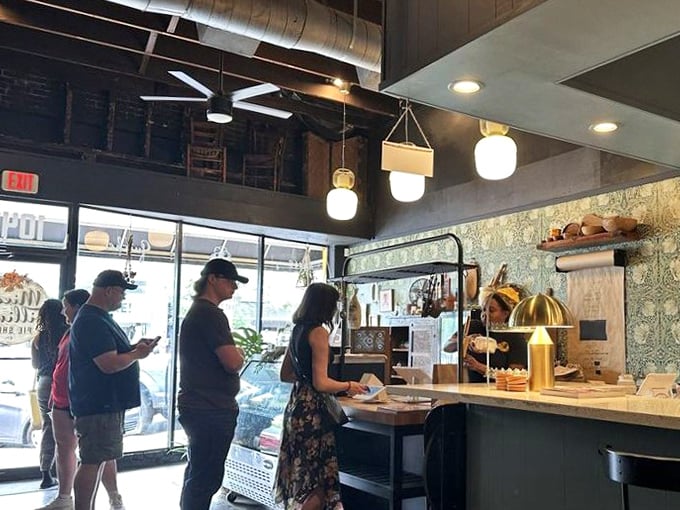 Customers eagerly awaiting their slice of heaven. The anticipation is almost as delicious as the pie itself.