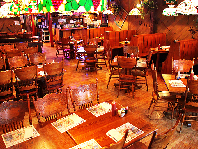 Wooden booths, stained glass lamps, and warm lighting create the perfect backdrop for making memories over hearty meals.