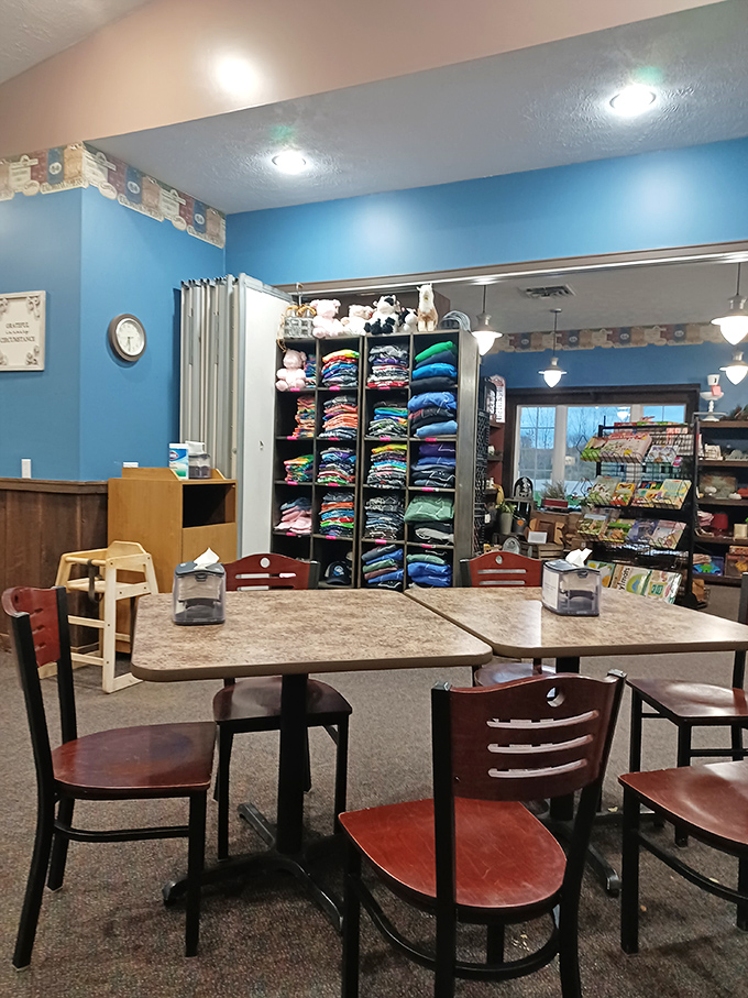 The cozy dining area invites visitors to settle in and savor their treats, with country-blue walls and rustic touches creating that perfect homespun atmosphere.