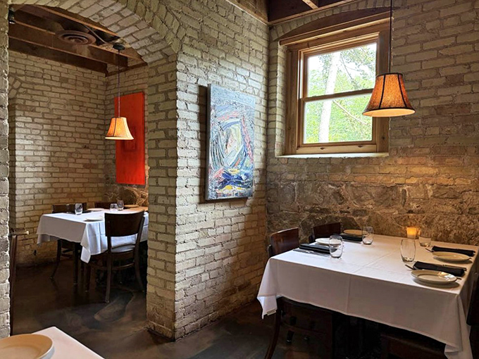 Intimate dining nooks carved from historic brick walls create the feeling you've discovered a secret Italian grotto beneath Michigan soil.