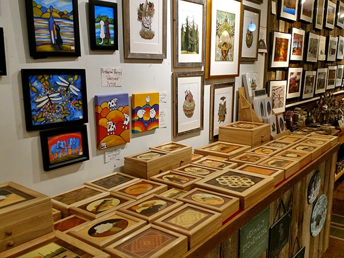 Local artwork adorns the walls, capturing Vermont's iconic landscapes from rolling hills to covered bridges in every season.