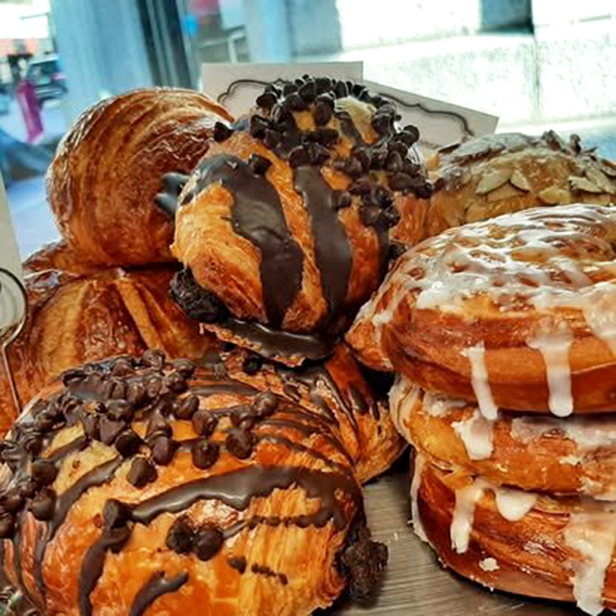 Fresh pastries stacked like buttery architecture, each croissant a flaky testament to the fact that the French really understood what breakfast should be.