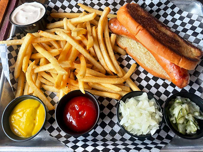 A classic combo that never disappoints: golden fries and a hotdog that's been elevated from ballpark fare to backyard barbecue royalty.