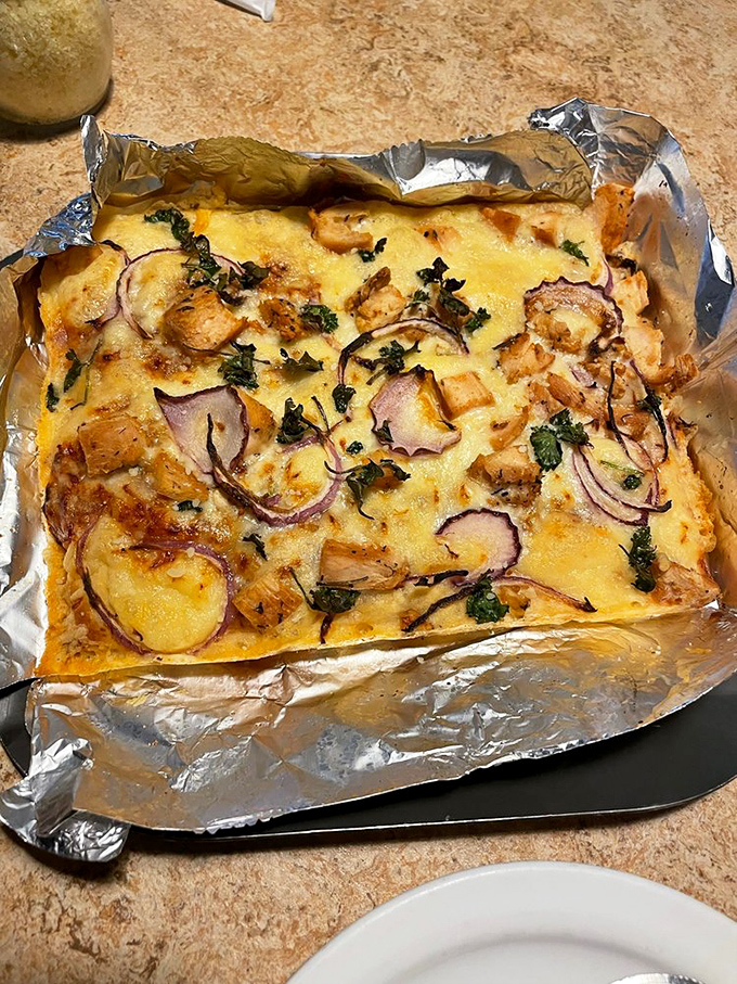 This BBQ chicken pizza on foil isn't just gluten-free, it's a flavor party where chicken, red onion and herbs all showed up dressed to impress.