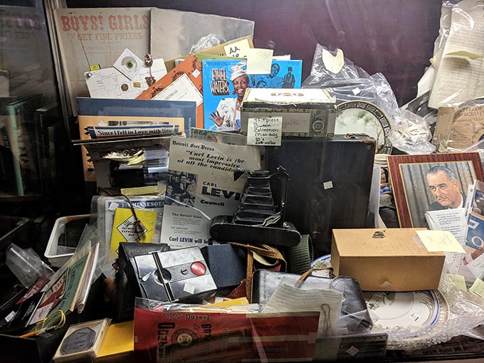 Random treasures pile up like a literary game of Jenga, proving that books and miscellaneous items coexist in beautiful, chaotic harmony here.