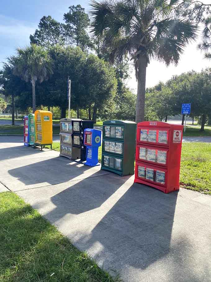 A rainbow of newspaper vending machines stands ready, offering a charmingly retro touch in our smartphone-dominated world.