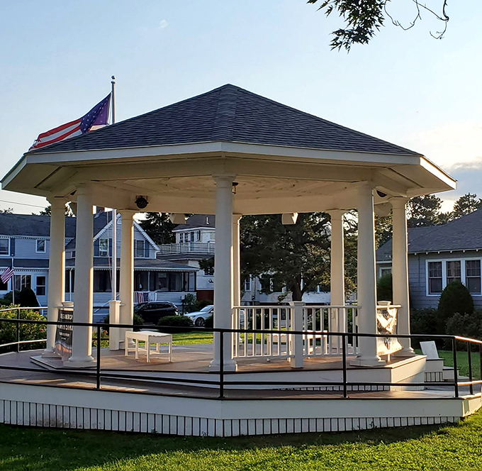 The Memorial Bandstand waits patiently for summer melodies, its classic octagonal design a perfect stage for community gatherings and sunset concerts.