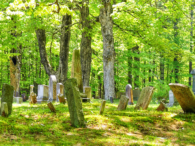 Spring brings a carpet of green to the cemetery, where moss-covered stones lean at precarious angles after centuries of Maine's freeze-thaw cycles.
