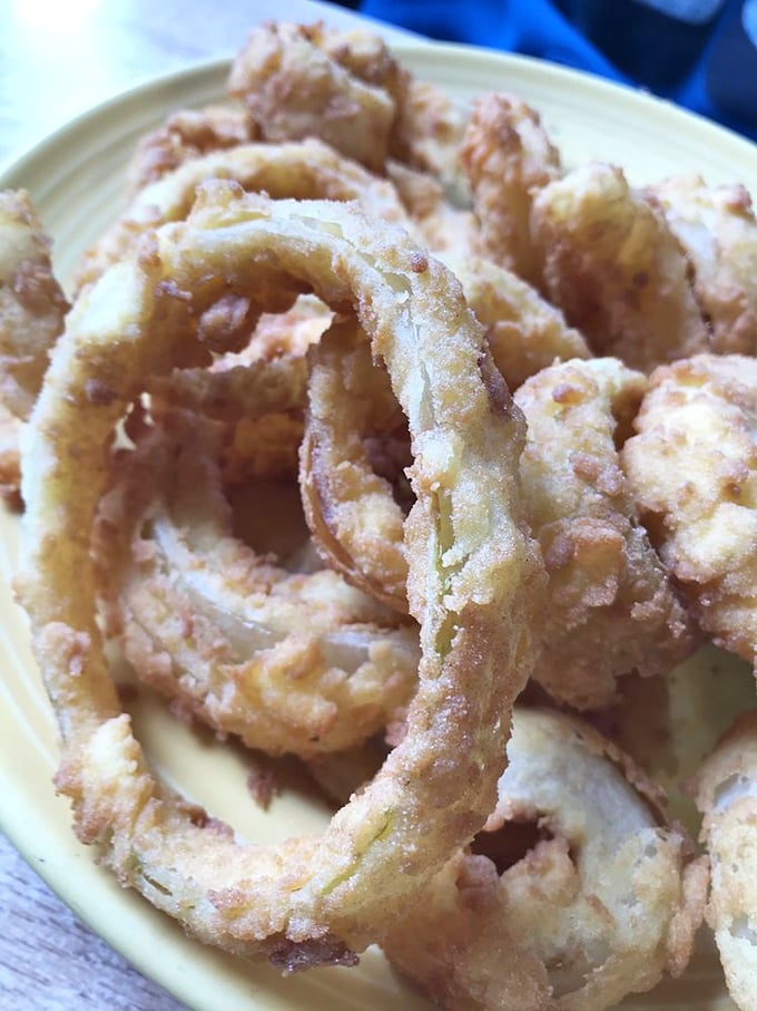 Golden onion rings that shatter with each bite, proving Deb's mastery extends well beyond breakfast classics.