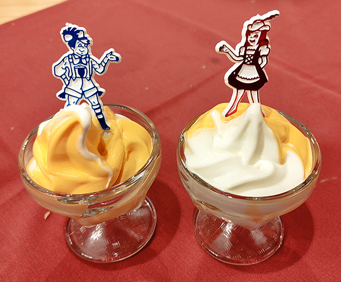 Sweet nostalgia served in glass dishes, where tiny Bavarian figures stand guard over creamy swirls of childhood memories.