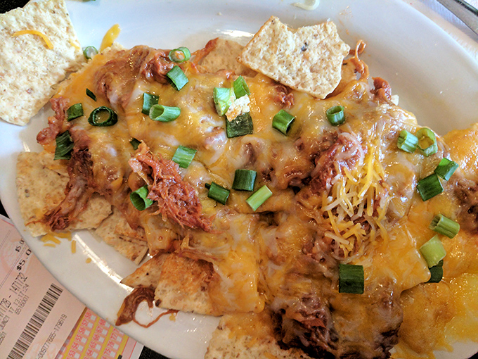 Pulled pork nachos that bring people together &ndash; a mountain of chips, tender meat, and melted cheese that demands to be shared. Unless you're really hungry.