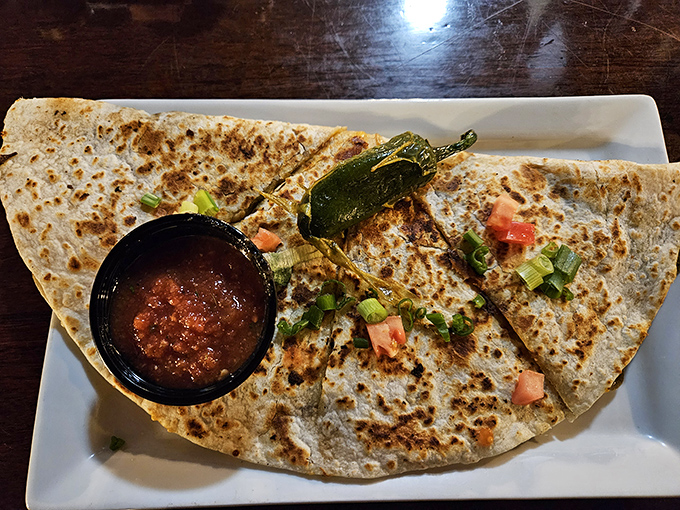 This quesadilla isn't just folded&mdash;it's transformed into a half-moon masterpiece, with melted cheese embracing fresh vegetables and a roasted jalape&ntilde;o crown.